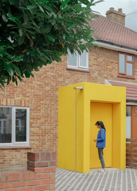 Unknown Works Finishes Clt House Extension With Bright Yellow Render