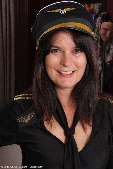 Mile High Milf Sherry Lee Strips Her Pilot Uniform Photos