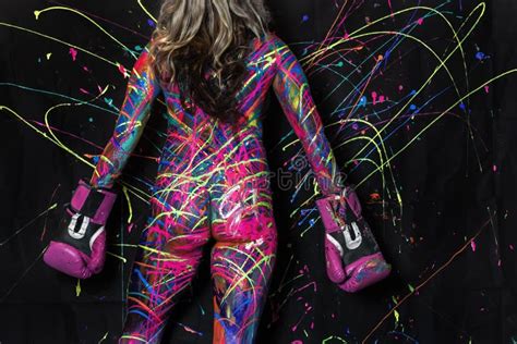 Naked Female Is Being Painted With Colorful Paint In A Home Environment