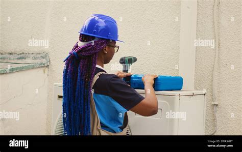 African American Expert Preparing For Routine Hvac System Checkup