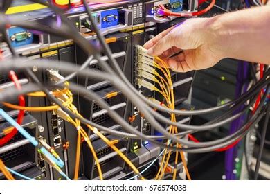 Woman Connecting Network Cables Switches Stock Photo 171079511 Shutterstock