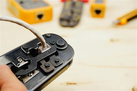 Premium Photo Internet Or Telephone Line Cables And Crimper Twisting Cable Tool Twisted Pair