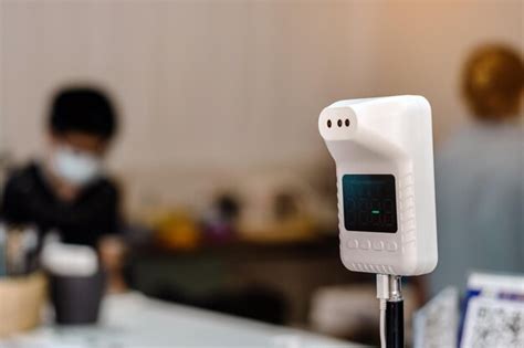 Premium Photo Digital Automatic Body Measuring Temperature Machine For Measuring Body Temperature