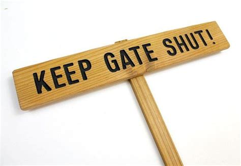 A Wooden Sign That Says Keep Gate Shut On Top Of A White Background