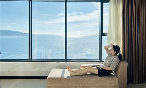 The Girl Is Lying On The Bed Enjoying The Sunlight And The Great View