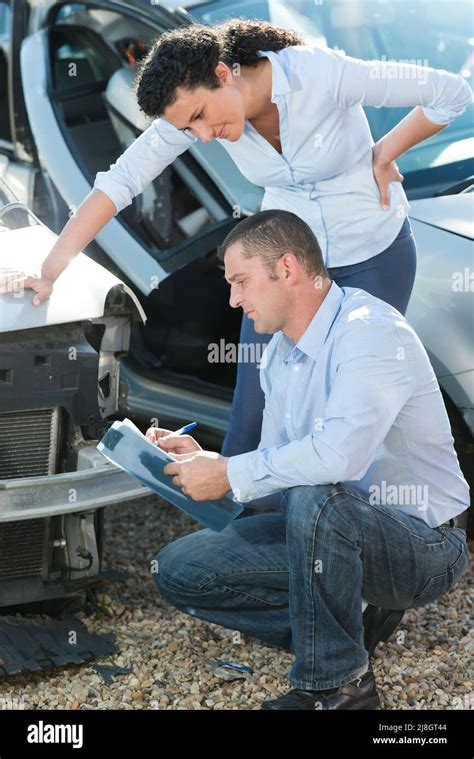 Insurance Agent Claim Process After Car Crash Stock Photo Alamy