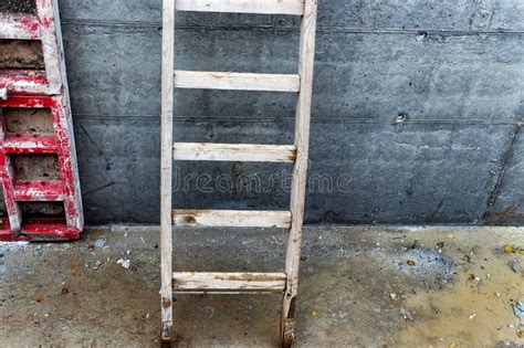 Wooden Ladder At The Construction Site Against The Background Of A