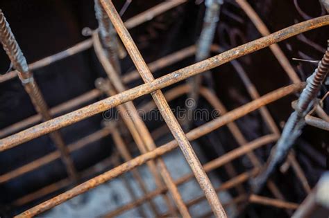 Construction Work On A Reinforced Concrete Foundation Highlighting The Rebar Structure At A