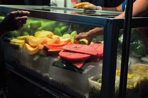 Premium Photo Midsection Of Person Having Food In Store Fruit Shop