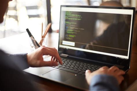 Premium Photo Back View Over The Shoulder Shot Of Developer Programmer With Laptop Program