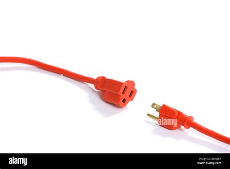 A Foot Orange Extension Cord Coiled Up With A Three Way Splitter Stock Photo Alamy