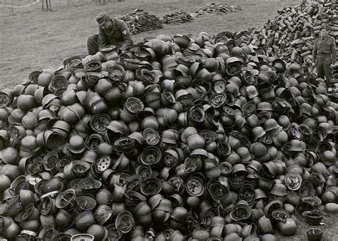 A Pile Of German Helmets Following The Surrender Of Germany In 1945