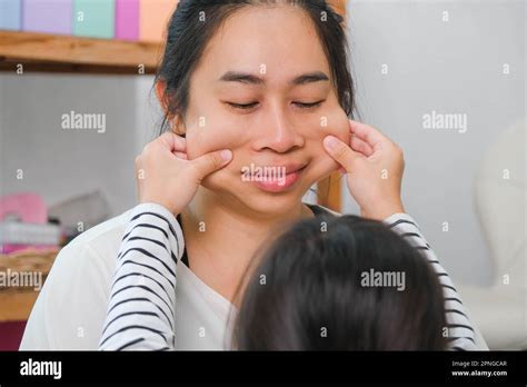 Mother And Her Daughter Playing And Hugging Smiling Mother And Funny