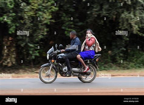 A Pillion Passenger Riding On Motorcycle Taxis Know As A Boda Boda In
