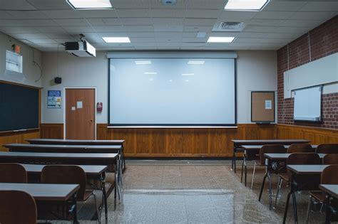 Empty Classroom With Projector Screen Premium Ai Generated Image