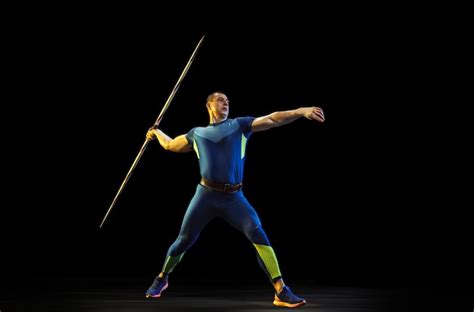 Free Photo Male Athlete Practicing In Throwing Javelin In The Dark