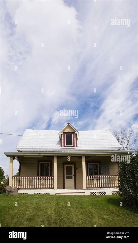 Old Circa 1850 Canadiana Cottage Style Home With Beige Wood Plank