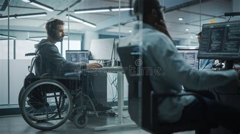 Disability Friendly Office Amazing It Programmer With Disability In A Wheelchair Working On