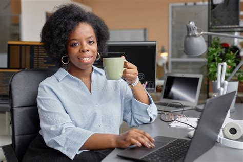 Female Computer Programmer Using Laptop Having Tea Stock Image Image