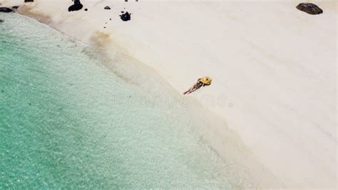 Aerial View Of Woman Relaxing On The Tropical Sandy Beach Top Wide Shot Of A Girl Lying With