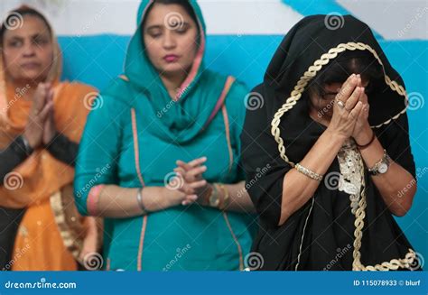 Indian Sikh Women Praying Inside Their Temple During Baisakhi Celebration In Mallorca Editorial