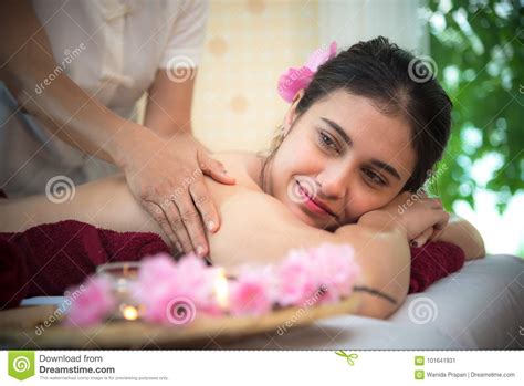 Masseur Doing Massage Spa With Treatment On Asian Woman Body In The