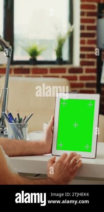 Vertical Video Office Worker Working With Isolated Greenscreen Display On Wireless Device