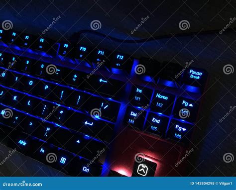 The Gaming Keyboard Shines With Multi Colored Keys For The Convenience Of Players Stock Photo