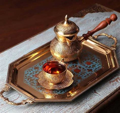 Set of brass coffee dala and brass coffee cup and saucer
