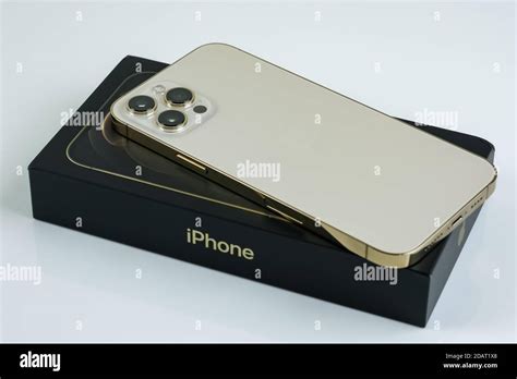 Iphone Pro Max In Gold Next To Its Box Stock Photo Alamy