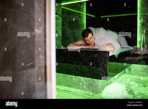 Man on the procedure of the foam massage in the hammam. Wellness and ...