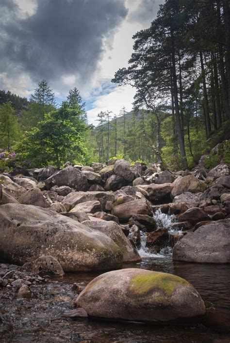 Small Waterfall Trickling Downstream In A Boulder Ridden Gulley Stock