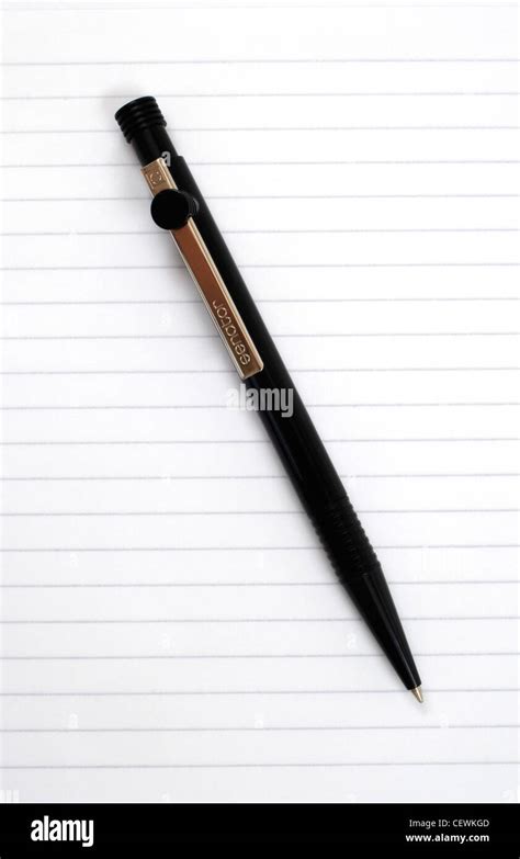 Close Up Of A Spiral Bound Pad Of Paper With A Black Pen Ball Point Pen