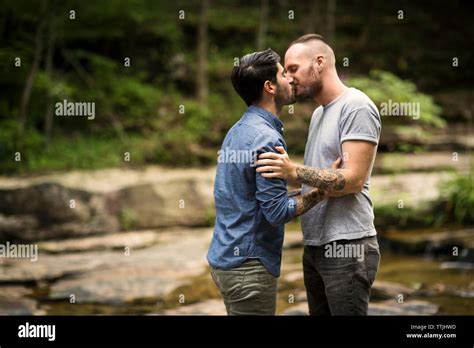 Homosexual Couple Kissing In Forest Stock Photo Alamy