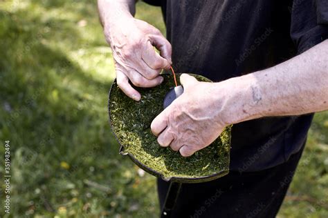 Disassembly And Installation Of The Line In The Grass Trimmer Stock Photo Adobe Stock