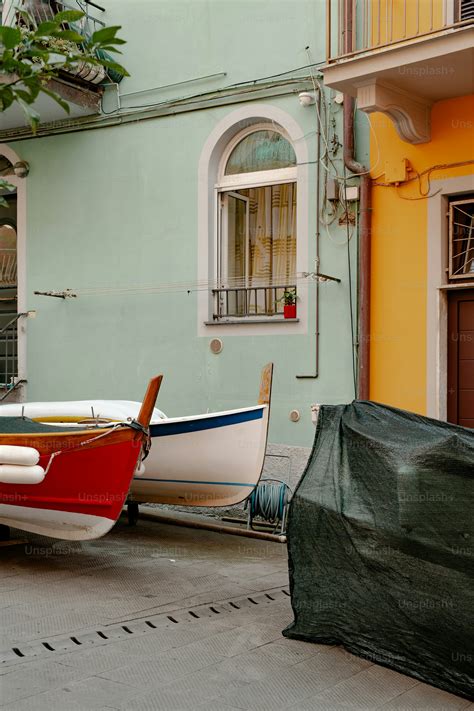 A Couple Of Boats That Are Sitting In The Street Photo Manarola Image
