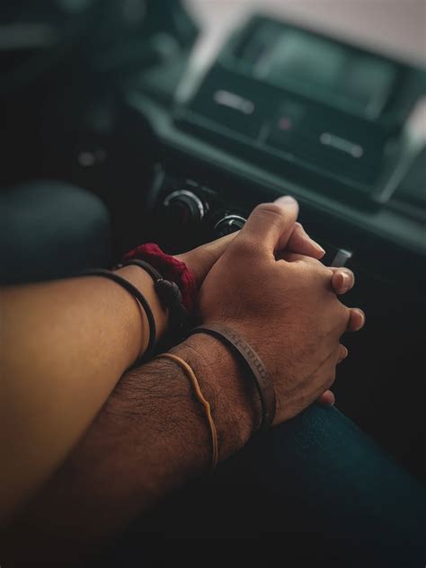Couple Holding Hands In Car