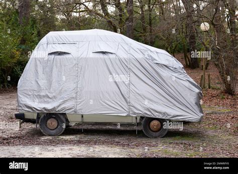 Rv Camper Van Car Covered With Grey Protective Cover By Townhouse For