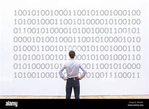 man programmer looking at binary code coding concept data encryption