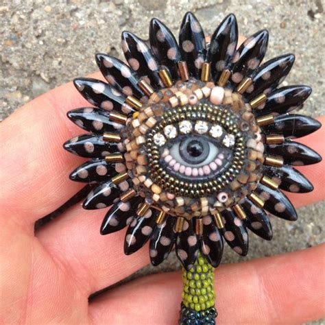 45x25x5 This Pin Was Made Using An Antique Glass Doll Eye Surrounded By Glass Beads And