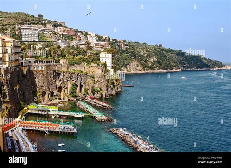 Cityscape Buildings On Hillside Swimming Area Umbrellas Close