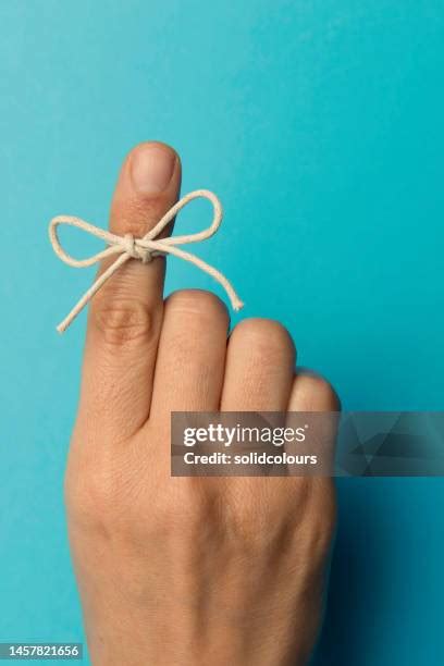 String Tied On Finger Photos And Premium High Res Pictures Getty Images