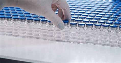 Premium Photo Hand Of Scientist Holding Flask With Lab Glassware And Test Tubes In Chemical