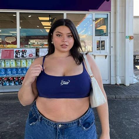 Download Confident Chubby Teen With Black Hair Wallpaper