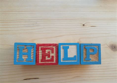 Premium Photo Close Up Of Help Text On Table