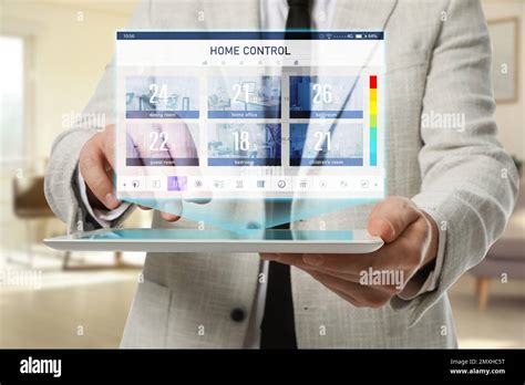 Man Using Laptop To Set Indoor Temperature Closeup Smart Home
