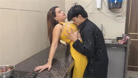 The Beautiful Wife Was Cooking In The Kitchen When The Husband Came And
