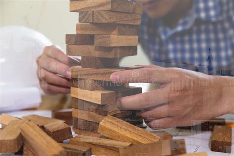 Man Architect Placing Blueprints Plan On Table To Design Building Model And Layout Stock Image