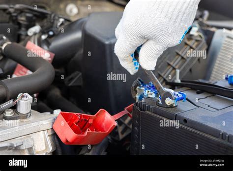 The Driver Is Replacing The Car Battery Battery Terminal Installation Car Battery Replacement