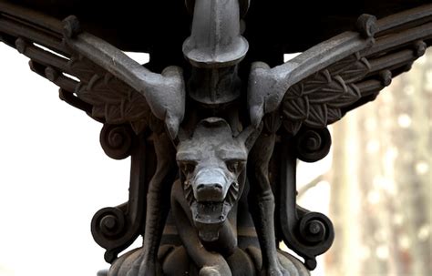 Premium Photo A Statue Of A Gargoyle With A Dragon On It